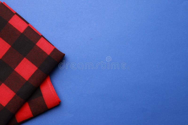 Folded Red Bandana with Check Pattern on Blue Background, Top View ...