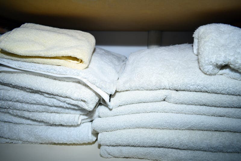Folded Towels Stacked Inside a Linen Closet Stock Photo - Image of ...