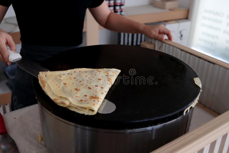 Folded Triangle Shape Crepe on Black Hot Plate. Stock Photo - Image of ...