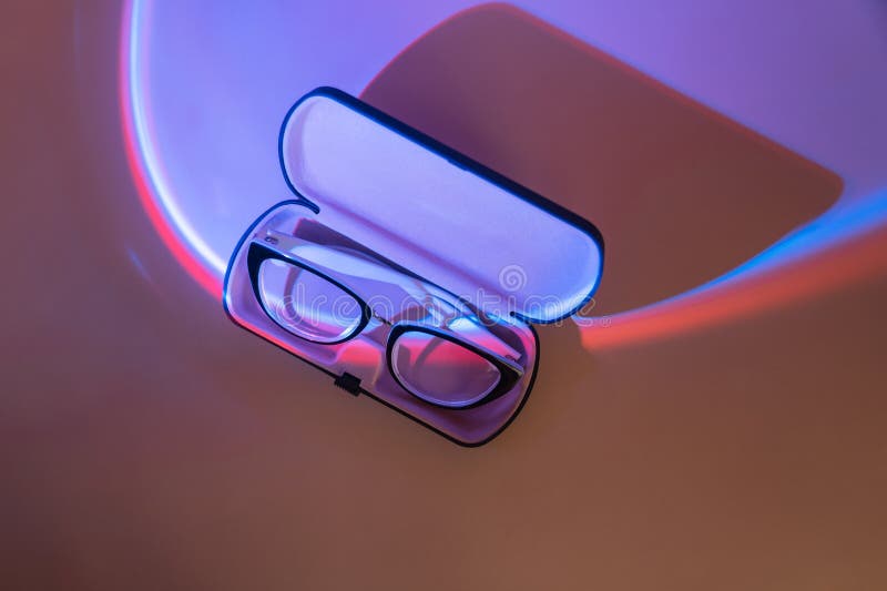 Folded Vision Glasses with Black Frames in a Light Case Under Blue ...
