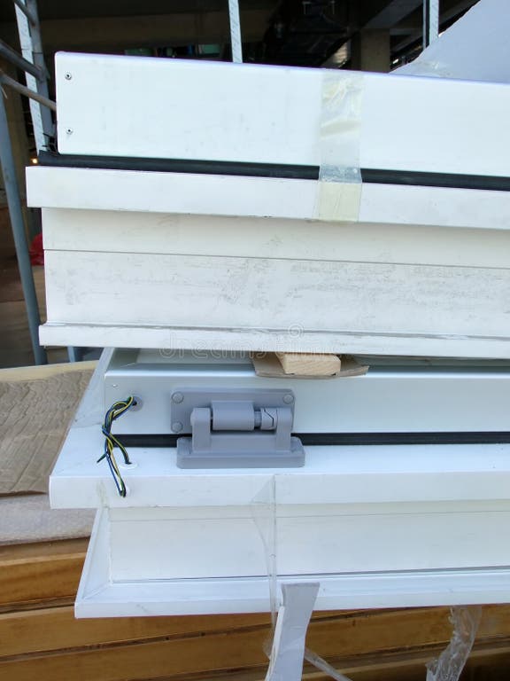 A Folded White Freezer Door with Hinges and Electrical Wiring Attached ...