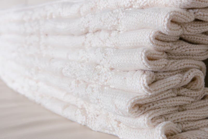 Folded white knitted throw stock image. Image of cotton - 51029059