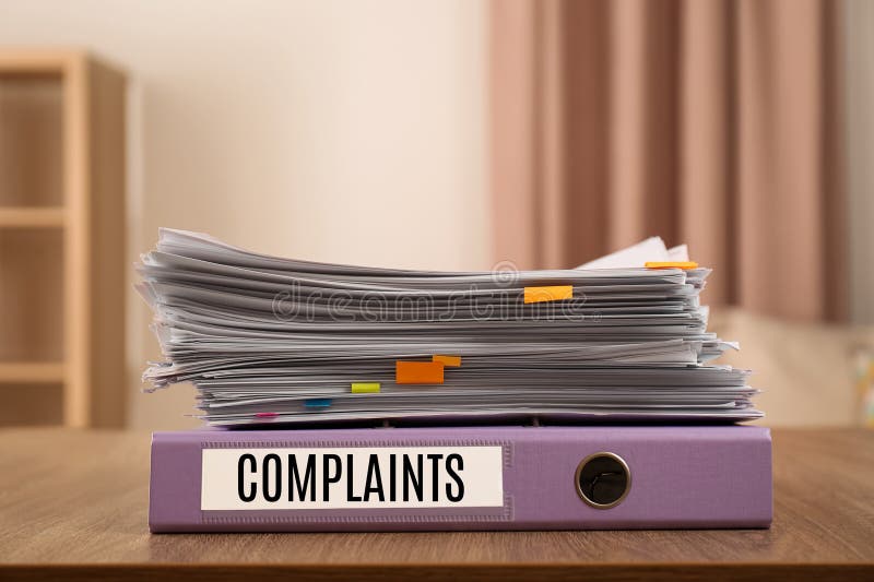 Folder with Complaints Label and Documents on Office Desk Stock Photo ...