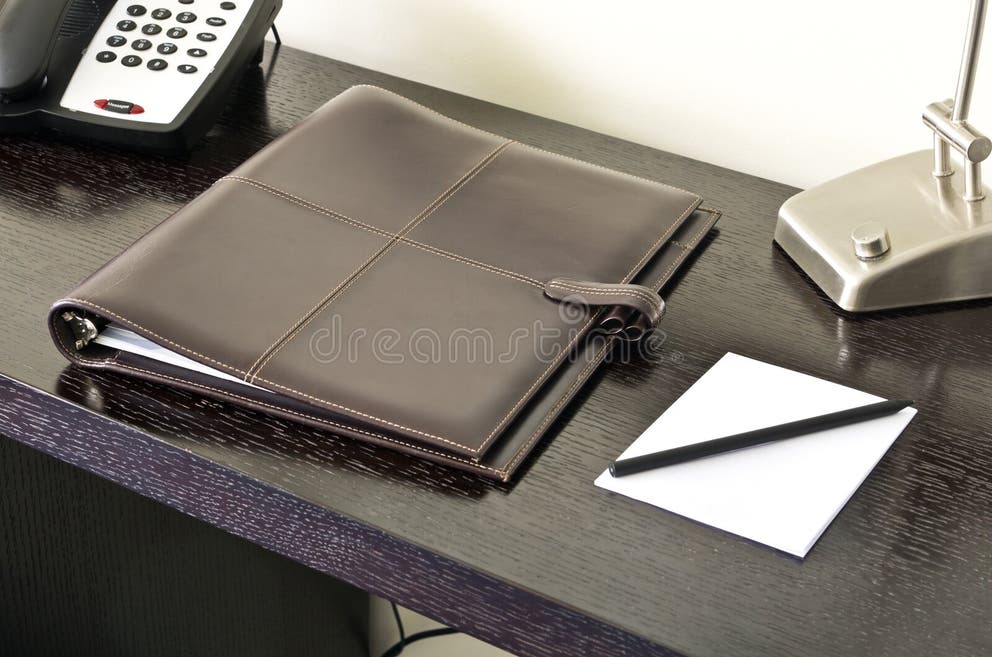 Folder on desk stock photo. Image of lamp, wrapper, business - 19550874