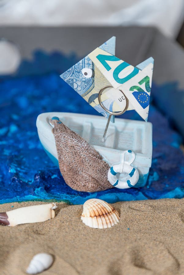 Folding a Banknote into a Fish - Origami Stock Photo - Image of ...