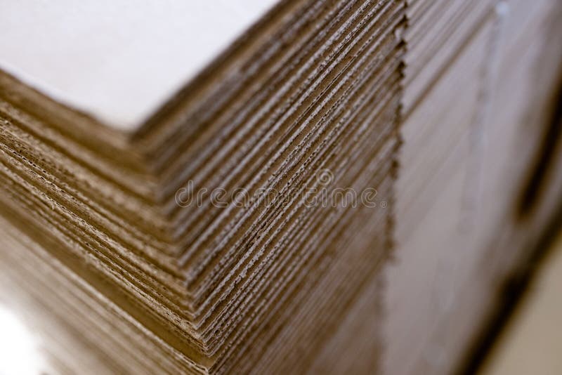 Folding Cardboard Boxes. Perforated Sheets of Corrugated Cardboard are ...
