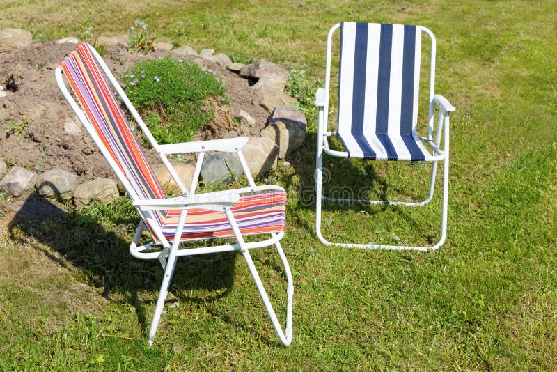 Folding Chairs on the Lawn in the Spring Stock Photo - Image of ...