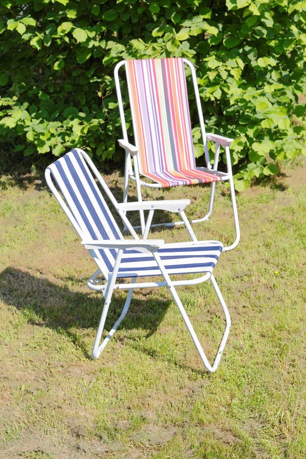 Folding Chairs on the Lawn in the Spring Stock Photo - Image of ...
