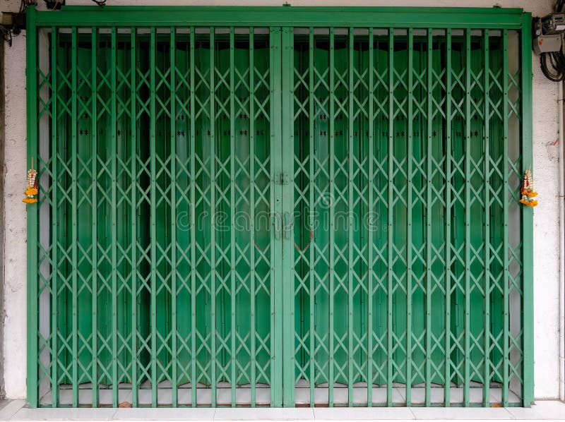 Folding Metallic Grill in Front of a Shop Stock Photo - Image of store ...