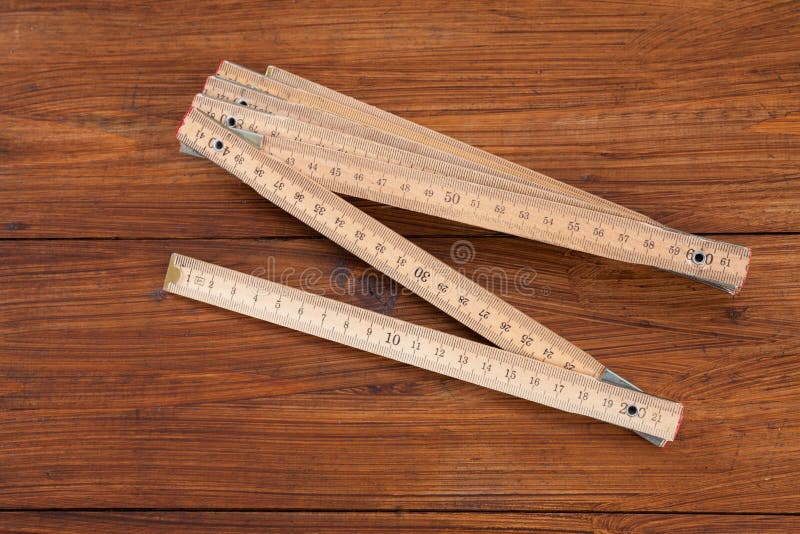 Folding rule on wood stock photo. Image of measurement - 58691768