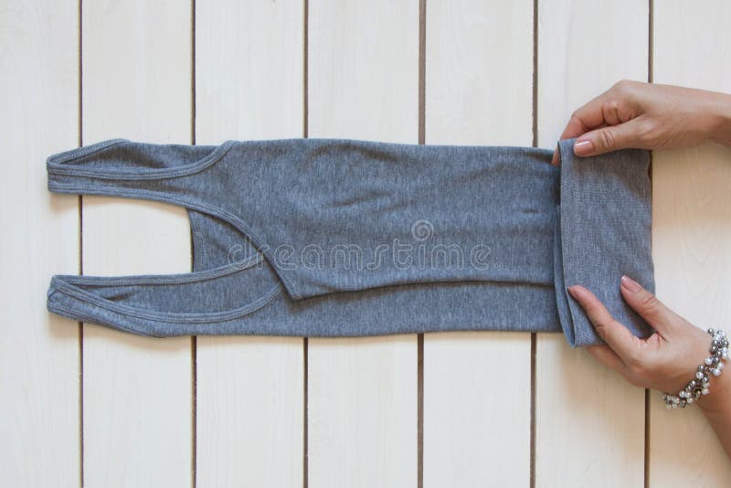 Folding the T-shirt. Keeping Things in the Japanese System Stock Image ...