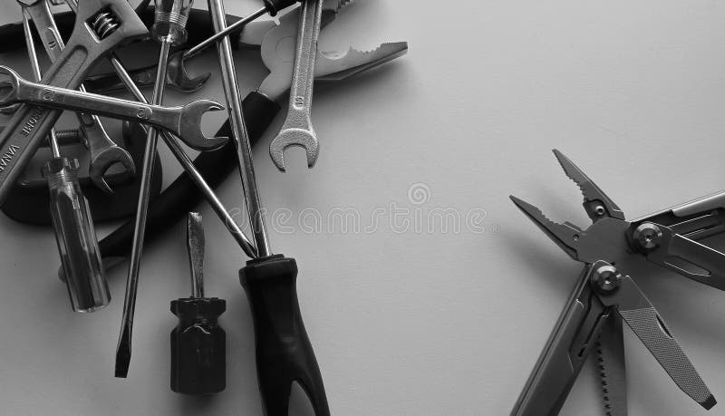 Folding Utility Multi-tool with Opened Blades Against a Bunch of ...