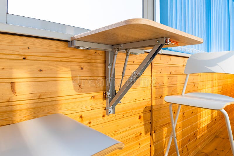 Folding Wooden Table Fixed on the Wall. Stock Image - Image of table ...