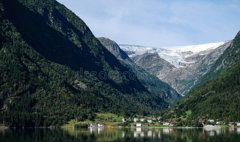 Folgefonna Glacier Cap in the Mountains with Lake and Village in the ...
