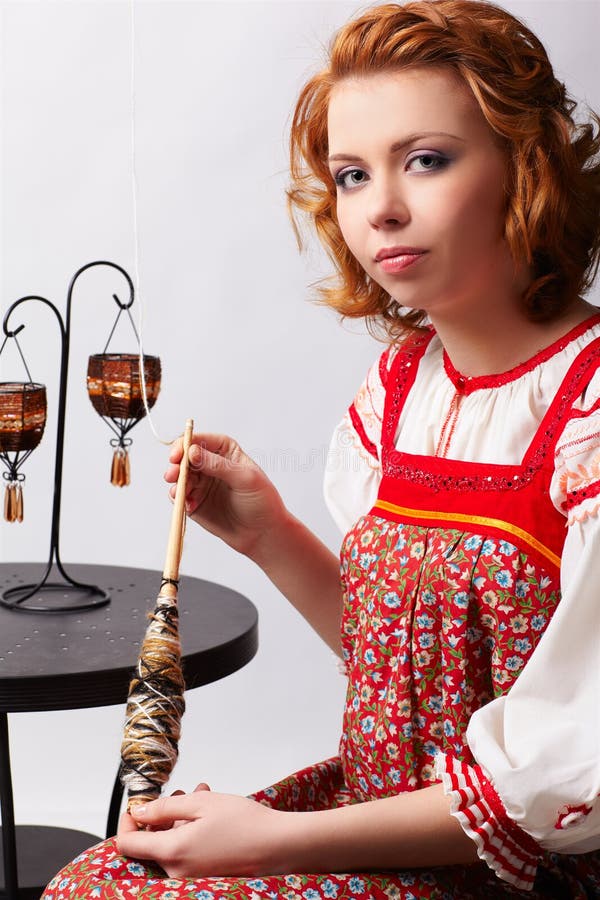 Folk girl with distaff stock image. Image of national - 20950475