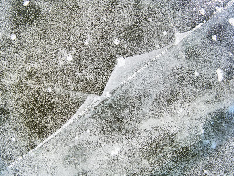 Follow Bubbles and Crack in the Ice on the Lake.Reflection of Sun Rays ...