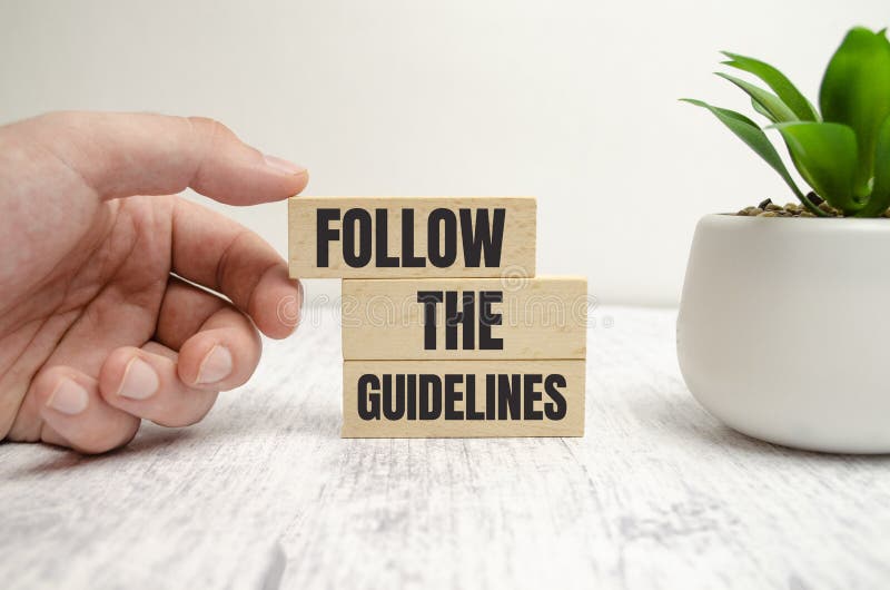 With FOLLOW the GUIDELINES Concepts on Wooden Blocks Stock Image ...