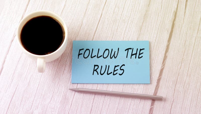 FOLLOW the RULES Text on the Blue Sticker with Cofee and Pen Stock ...