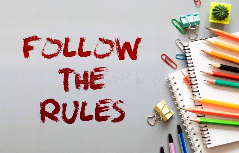 Follow the Rules Text Written on a Notebook with Pencils Stock Photo ...