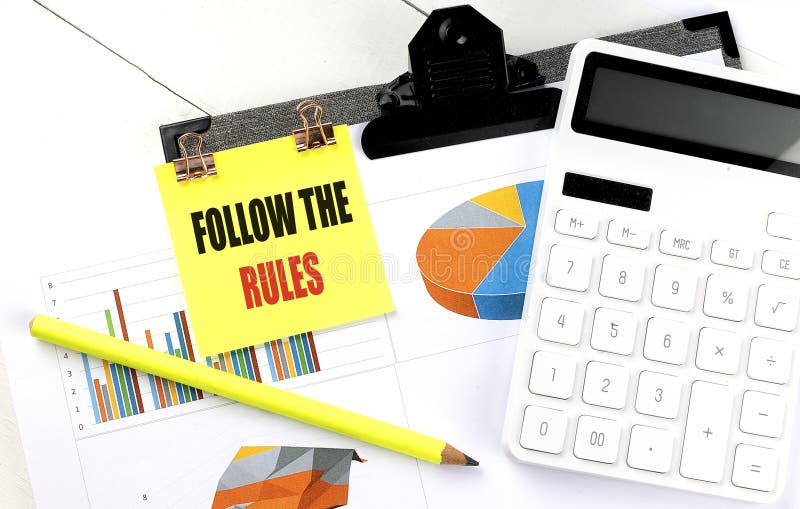 FOLLOW the RULES Text on Yellow Sticky with Calculator, Pencil and ...