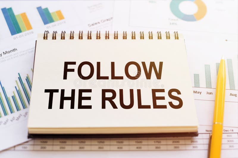 FOLLOW the RULES - Written on Notepad on Financial Charts and Graphs ...