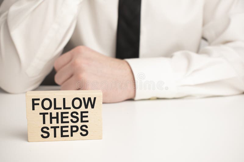 Follow these Steps Text on White Paper on the Wood Table Stock Photo ...