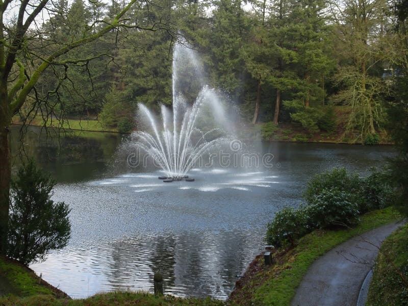 A fontain at a theme park stock image. Image of summer - 357746687