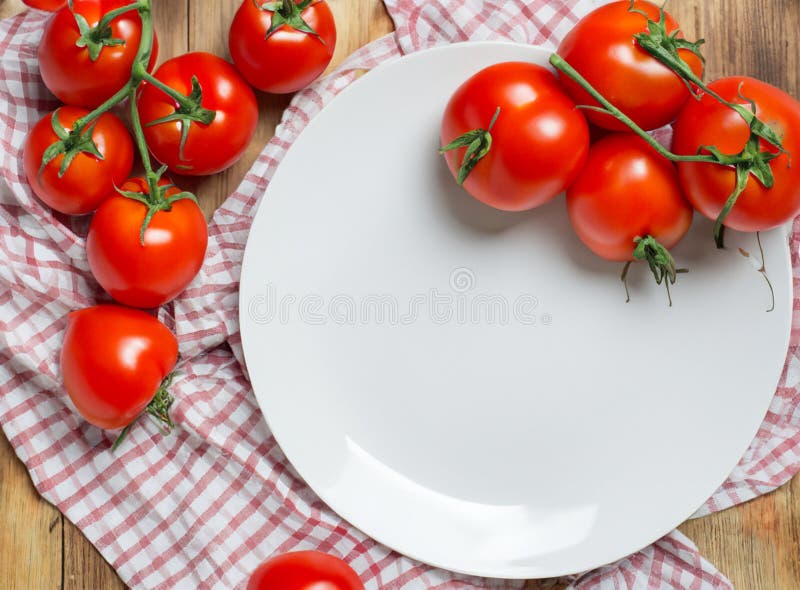 Food Background with Empty Plate, Tomatoes and Kitchen Towel Stock ...