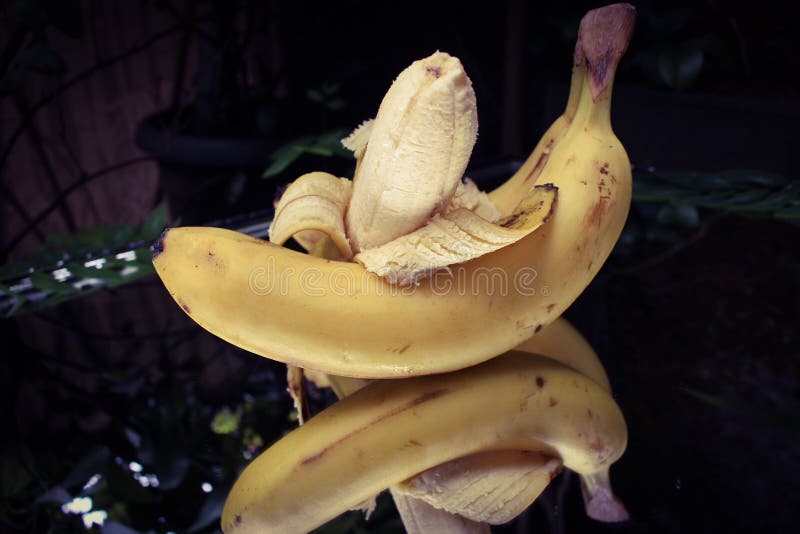 Banana on the mirror stock photo. Image of banana, mirror - 207841014