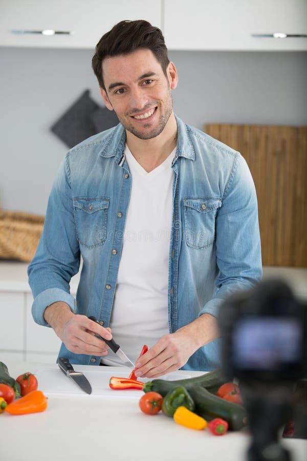 Food Blogger Eating Near Microphone at Table in Room. Mukbang Vlog ...