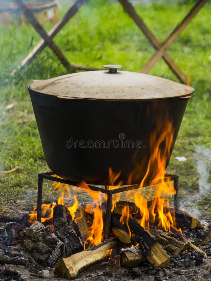 Food in a Cauldron on a Fire. Cooking Outdoors in Cast-iron Cauldron ...