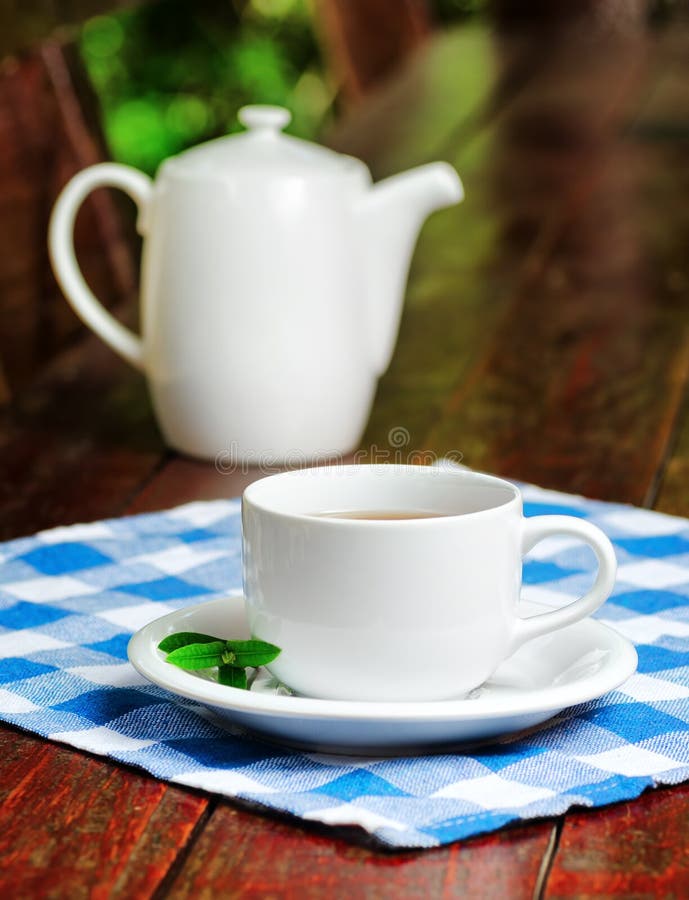 Cup of tea on wooden table stock photo. Image of herbs - 37050190