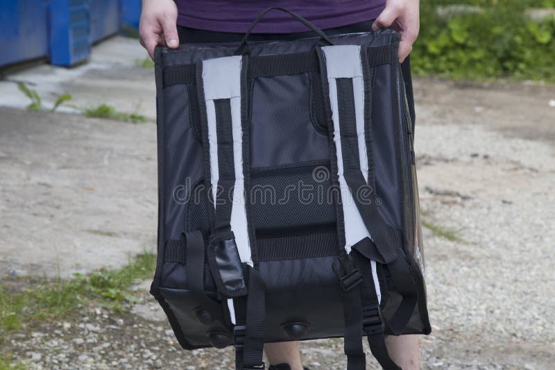 Food Delivery at Home.a Delivery Man with a Special Backpack Stock ...