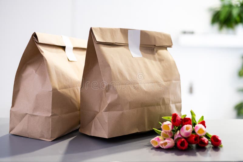 Man with Food Delivery Package with Packages on His Head Stock Photo ...