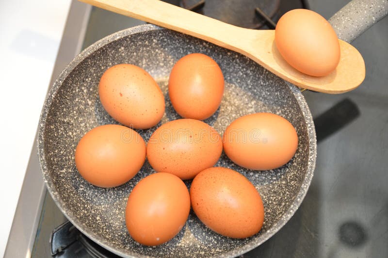 Eggs fresh in cooking pan stock photo. Image of cooking - 111275908