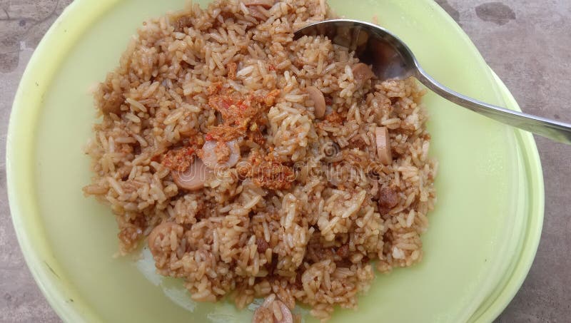 The Food Menu for Fried Rice in a Green Container and a Spoon Next To ...