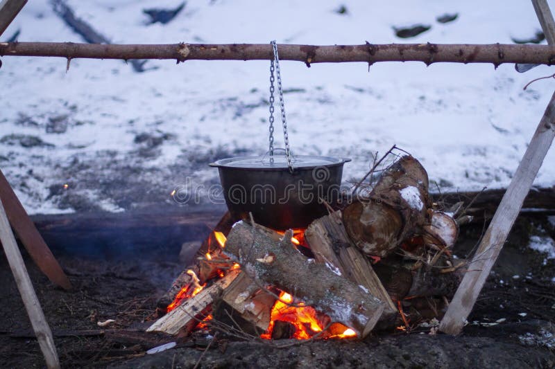 Food is Prepared in a Cauldron on an Open Fire, Rest in the Evening in ...
