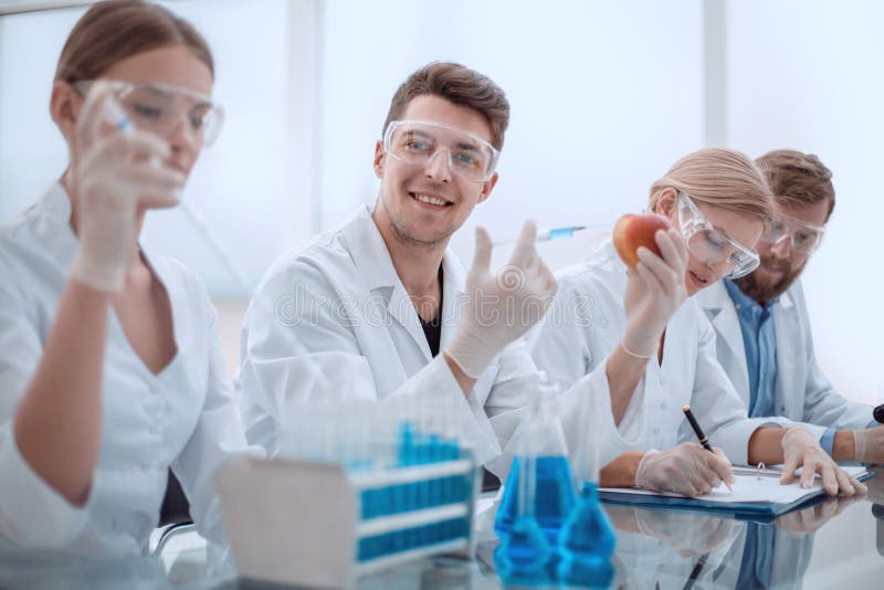 Close Up. Group of Experts Checking the Quality of Fruit Stock Image ...