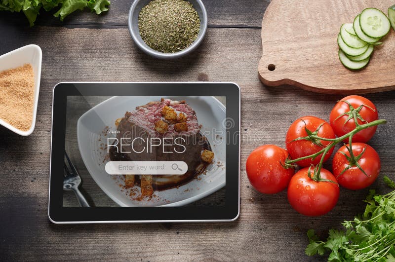 Food Recipes Tablet Computer on Rustic Wooden Table Stock Image - Image ...