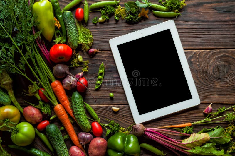 Food Recipes Tablet Computer on Rustic Wooden Table Stock Image - Image ...