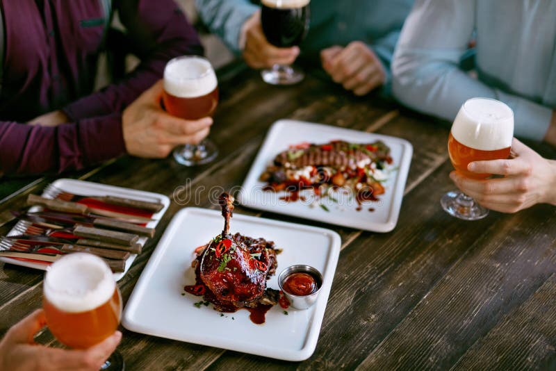 Food in Restaurant. Meat Dishes and Beer on Table Stock Image - Image ...