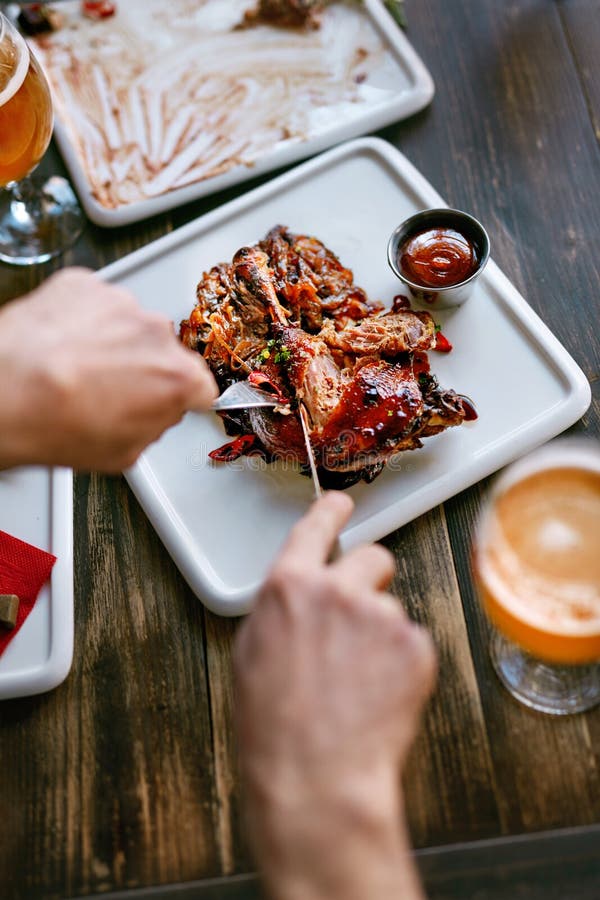 Food in Restaurant. Meat Dishes and Beer on Table Stock Photo - Image ...
