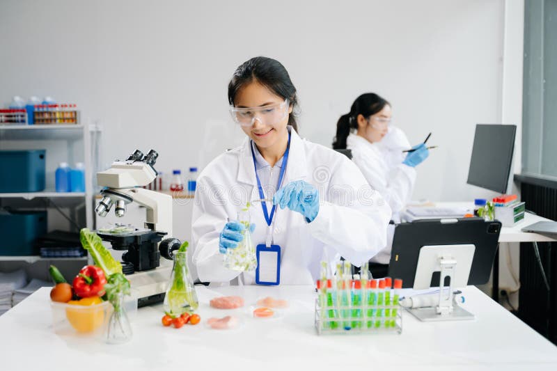 Food Science As Lab Scientists Test and Analyze Vegetables for Safety ...