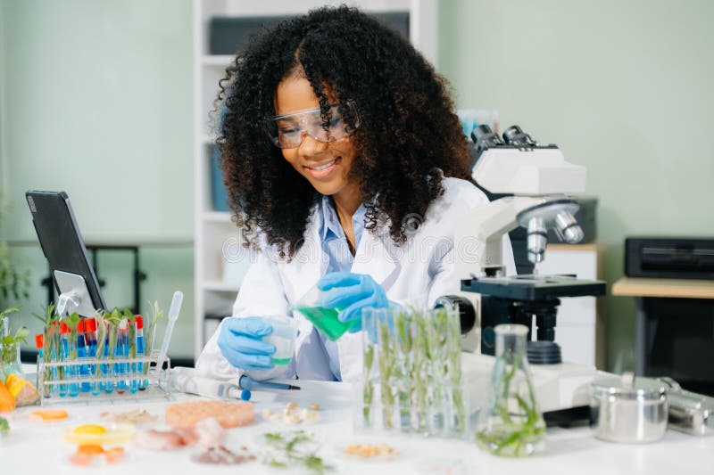 Food Scientist in a Lab Testing Food Samples with Modern Equipment ...