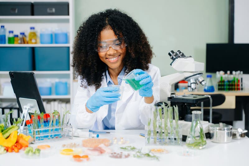 Food Scientist in a Lab Testing Food Samples with Modern Equipment ...