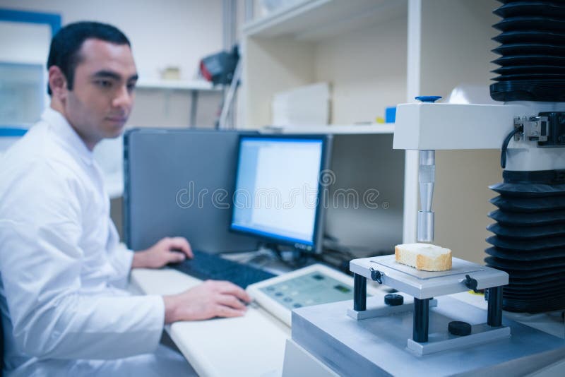 Food Scientist Using Technology To Analyse Bread Stock Photo - Image of ...
