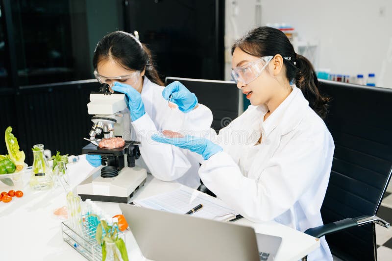 Food Scientists in Lab Coats, Testing Samples, and Analyzing Food ...