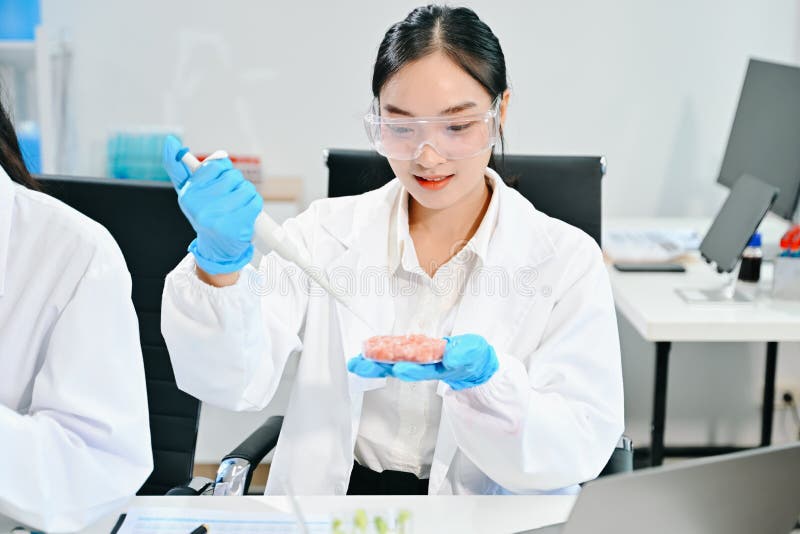 Food Scientists in Lab Coats, Testing Samples, and Analyzing Food ...