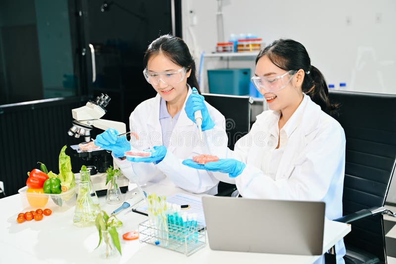 Food Scientists in Lab Coats, Testing Samples, and Analyzing Food ...
