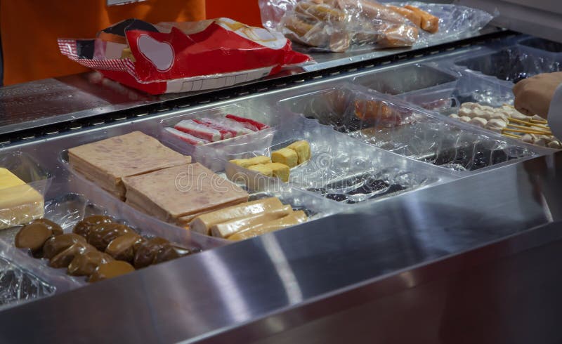 Food Worker Put Food in Plastic Tray for Packing Stock Photo - Image of ...
